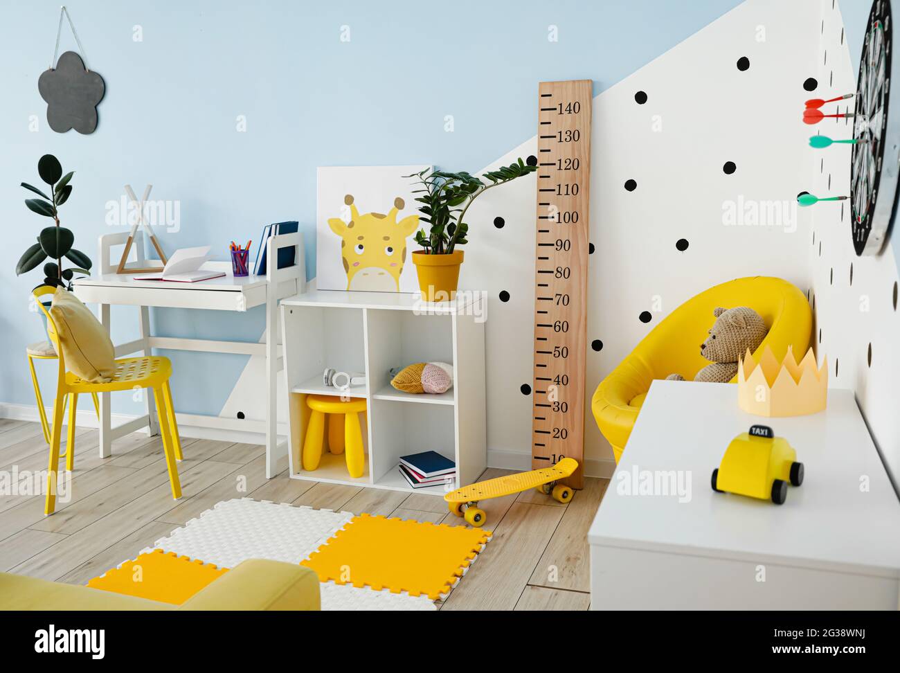Stylish interior of modern children's room with wooden stadiometer ...