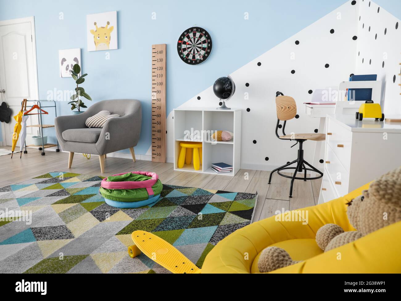Stylish interior of modern children's room with wooden stadiometer ...
