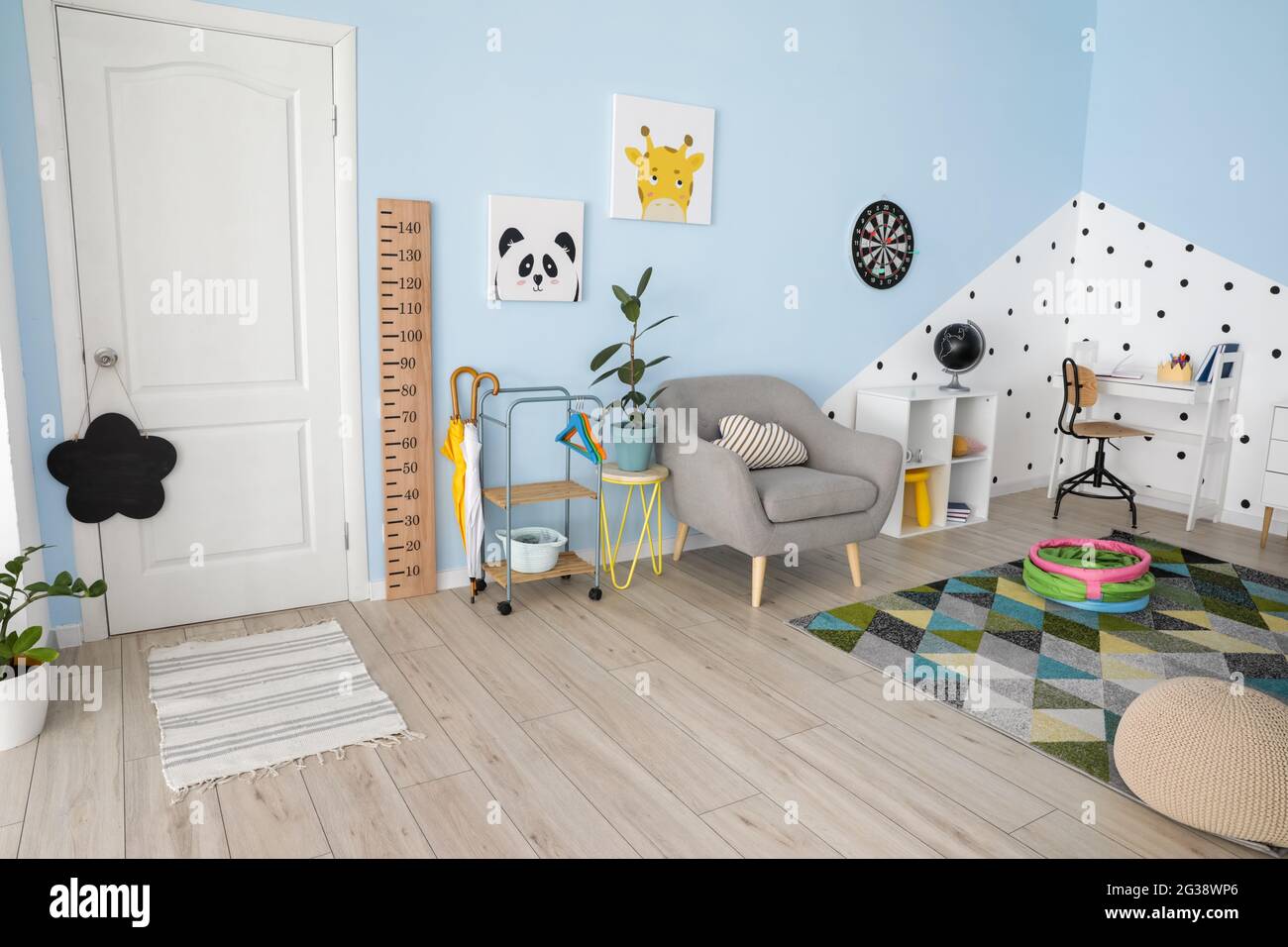 Stylish interior of modern children's room with wooden stadiometer ...