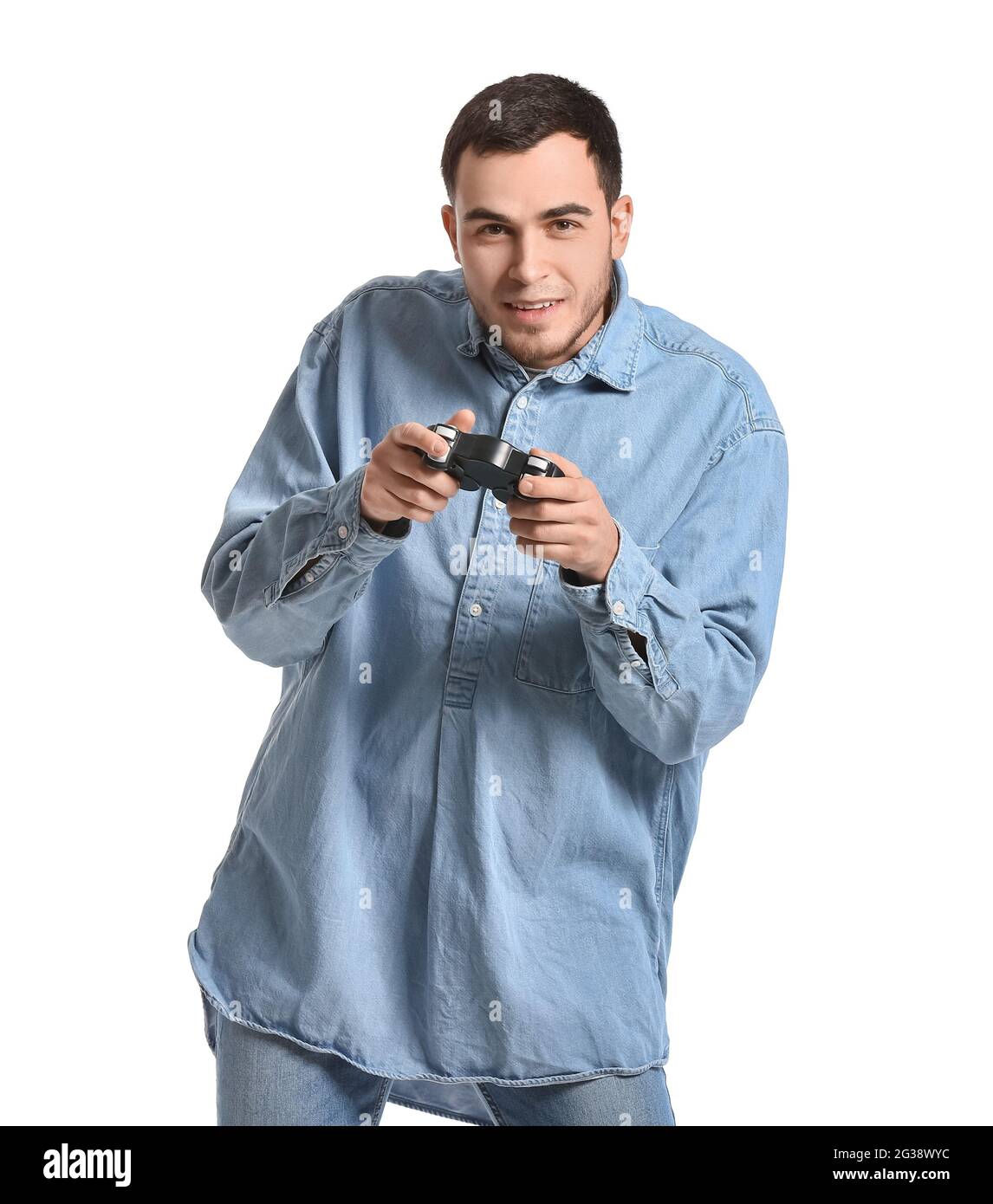 Handsome young man playing video game on white background Stock Photo ...