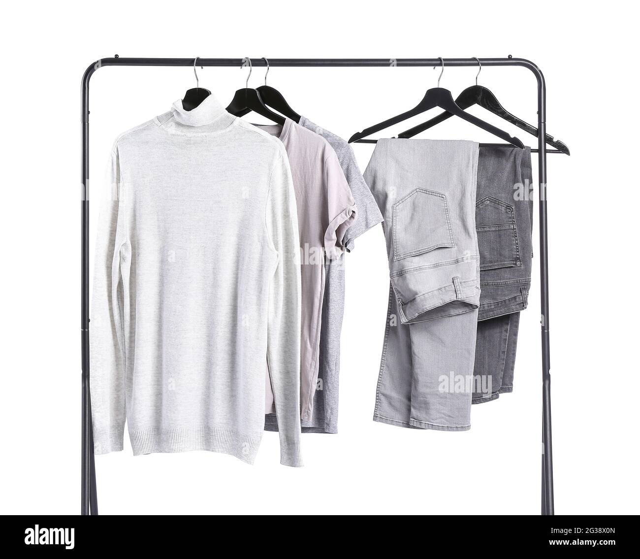 Rack with modern clothes on white background Stock Photo - Alamy