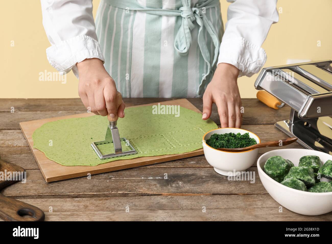 Female chef making delicious ravioli at table, closeup Stock Photo - Alamy