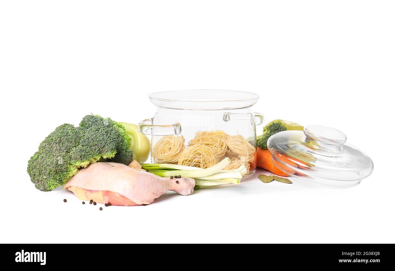 Stylish cooking pot and products on white background Stock Photo - Alamy