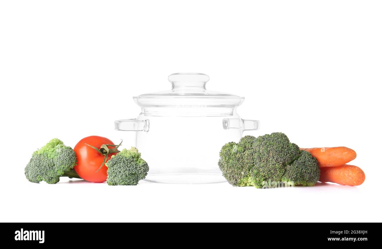 Stylish cooking pot and vegetables on white background Stock Photo - Alamy