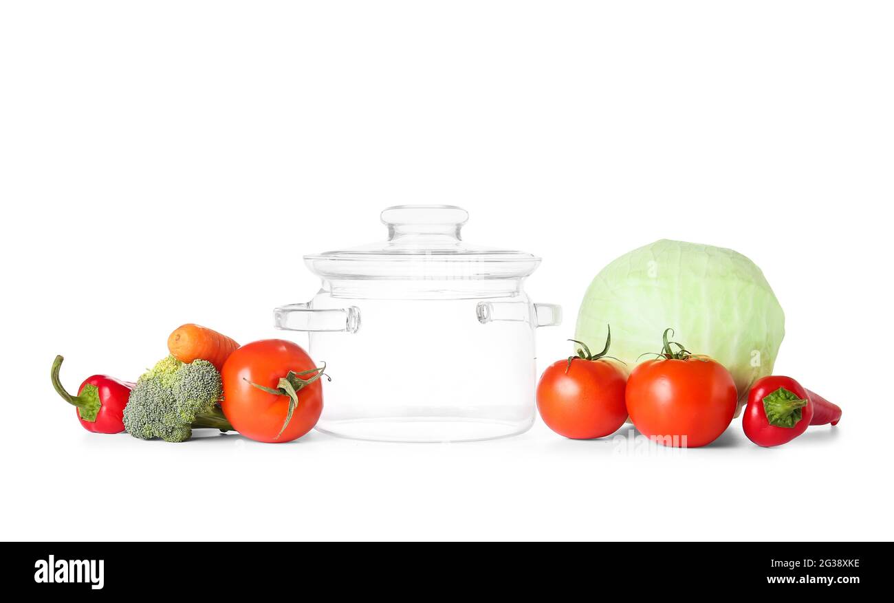 Stylish cooking pot and vegetables on white background Stock Photo - Alamy