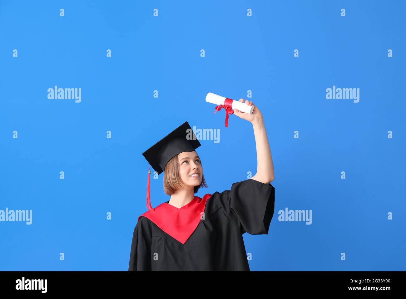 Female graduating student with diploma on color background Stock Photo ...