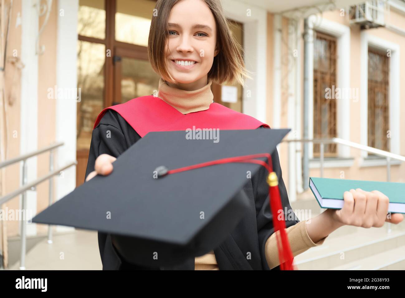Female student in bachelor robe on her graduation day Stock Photo - Alamy