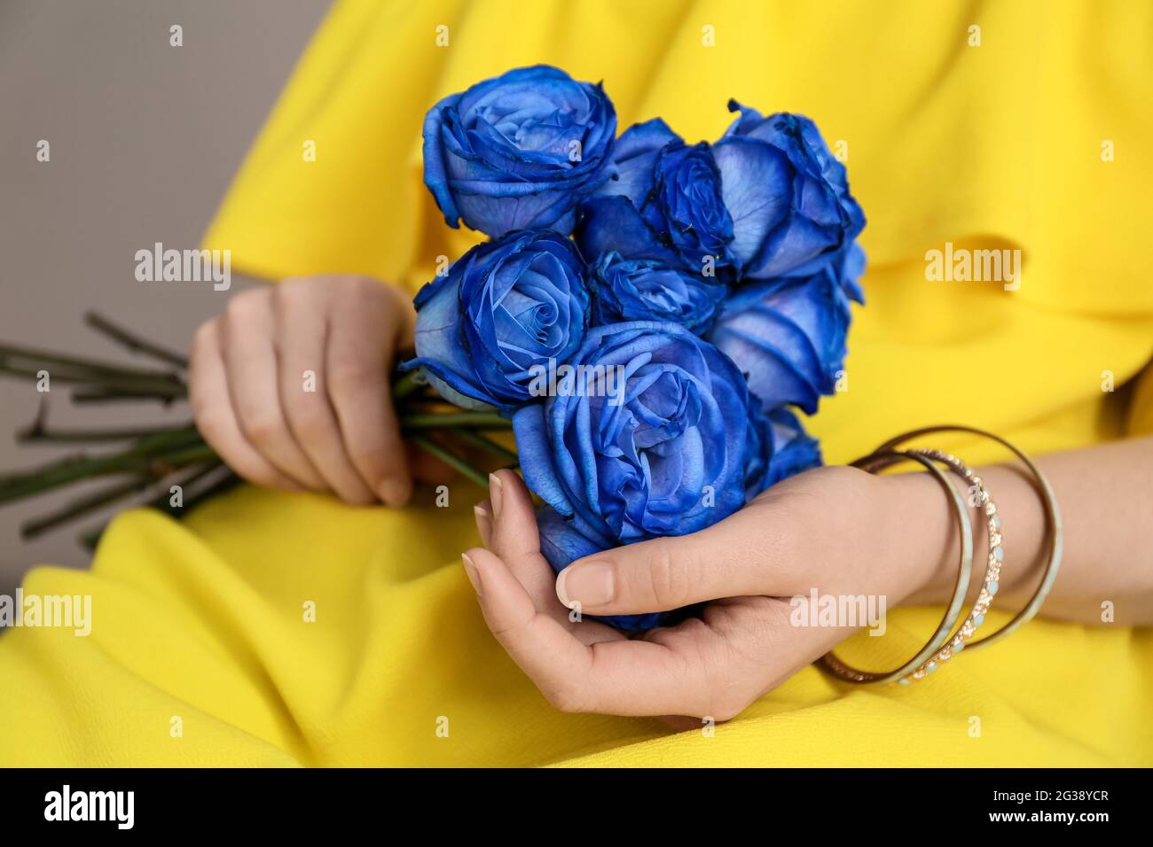 Woman with beautiful blue roses, closeup Stock Photo - Alamy