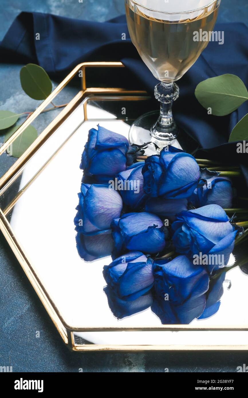 Beautiful blue roses on glass tray Stock Photo - Alamy