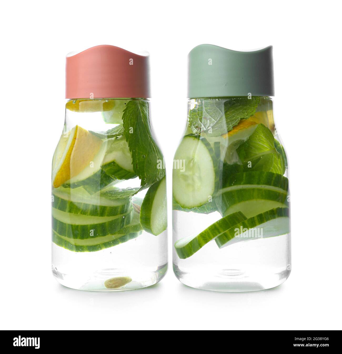 Bottles with cucumber lemonade on white background Stock Photo - Alamy