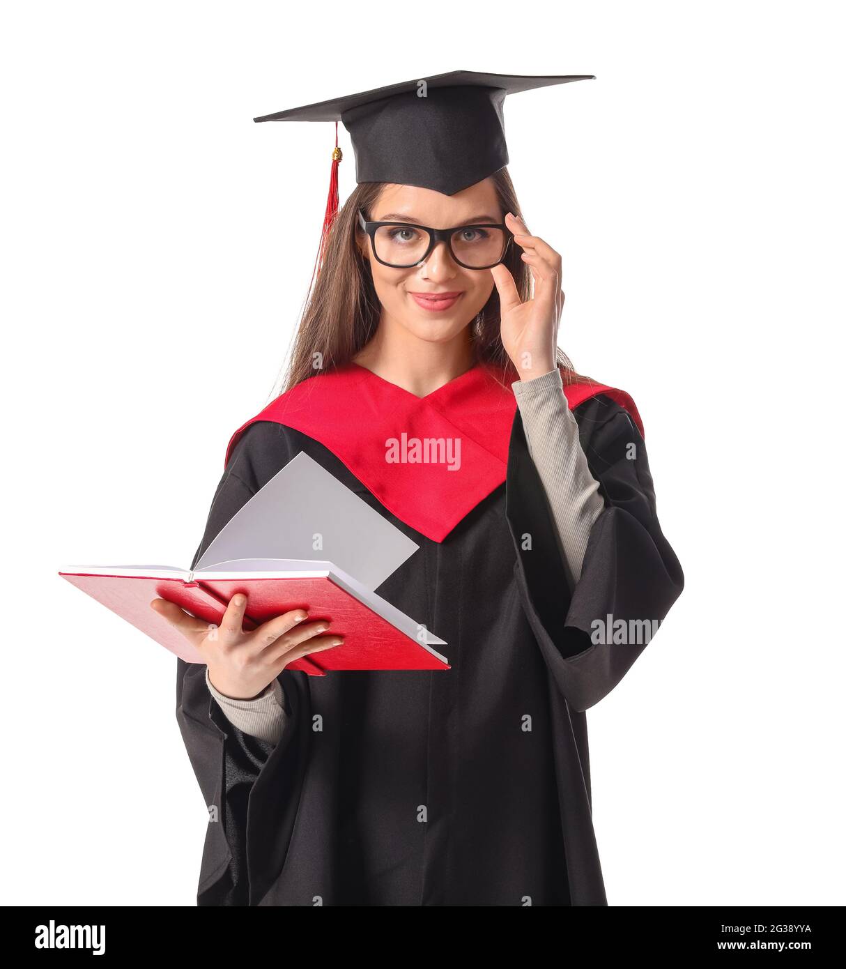 Female graduating student with book on white background Stock Photo - Alamy
