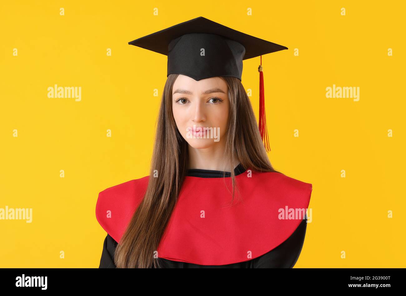 Female graduating student on color background Stock Photo - Alamy