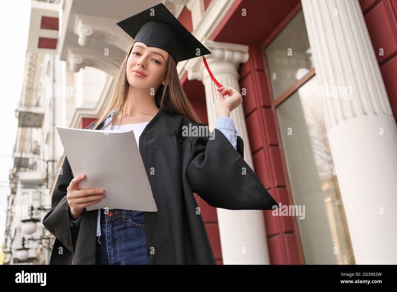 Female student in bachelor robe on her graduation day Stock Photo - Alamy