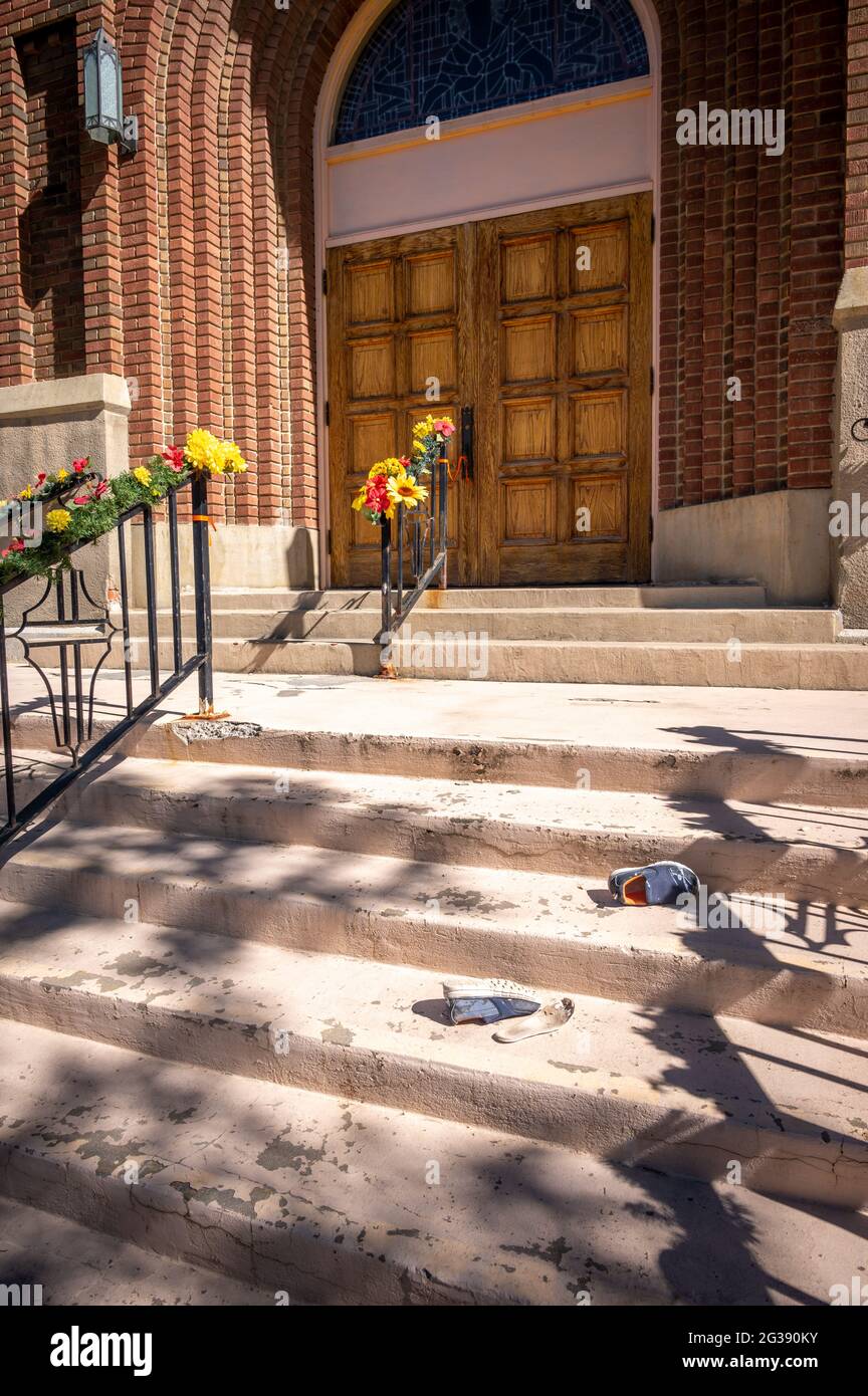 Kids shoes thrown on steps of a Catholic Church in the city of ...