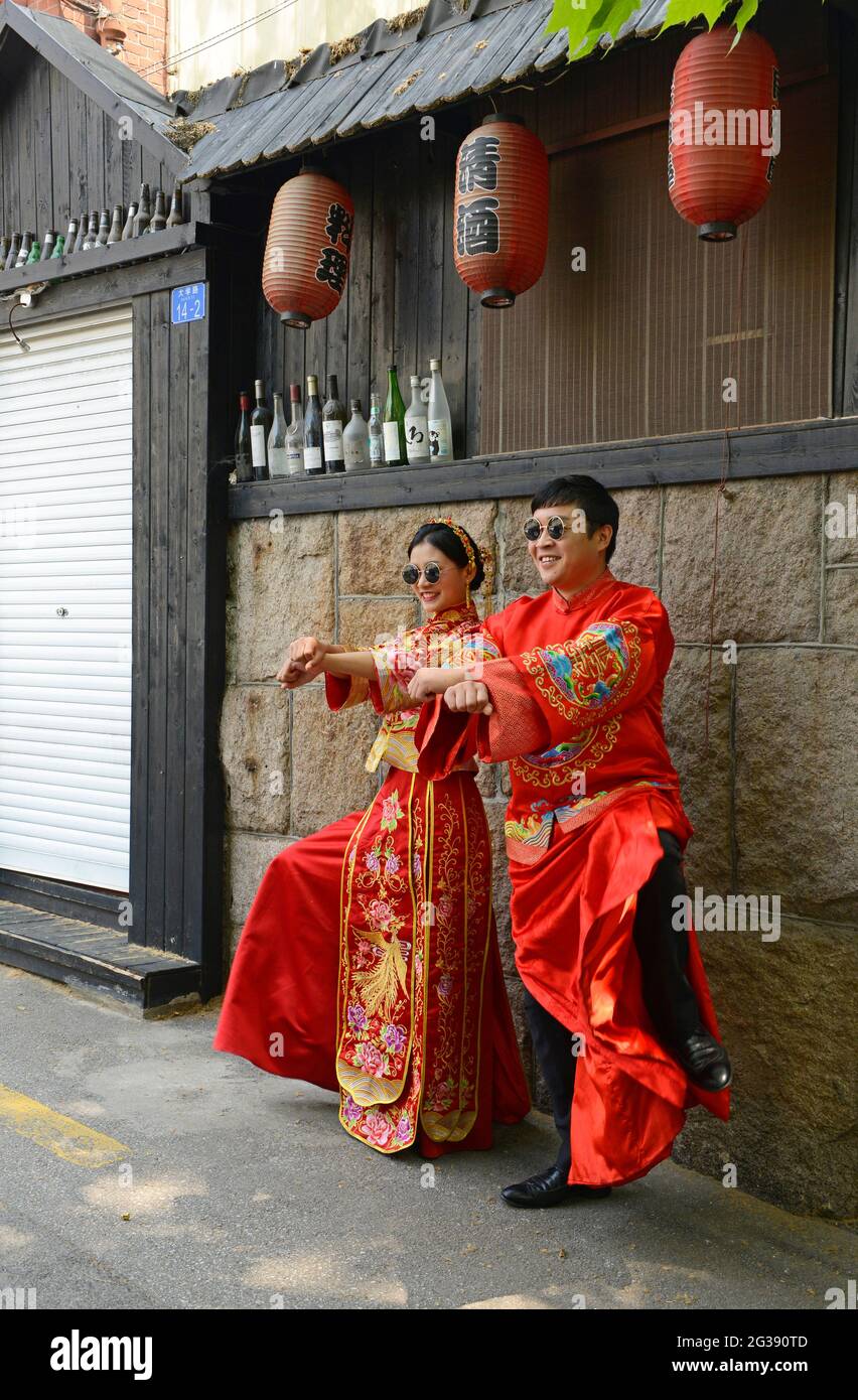 A couple have their wedding photos prior to the big day in the old town ...