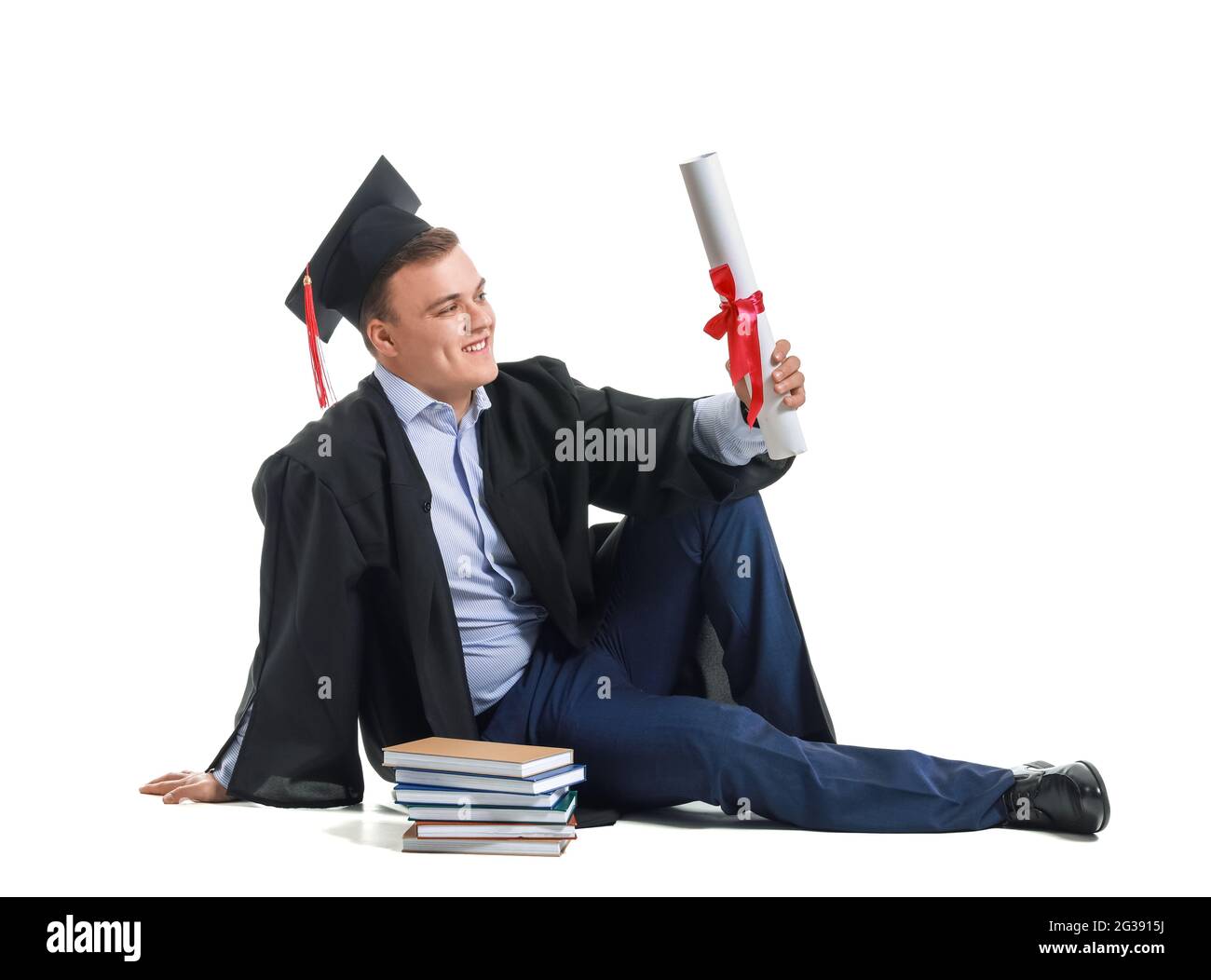 Male graduating student on white background Stock Photo - Alamy