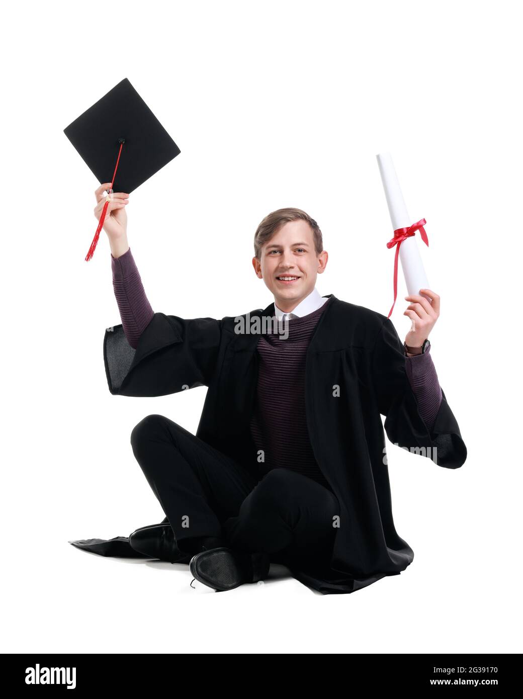 Male graduating student on white background Stock Photo - Alamy