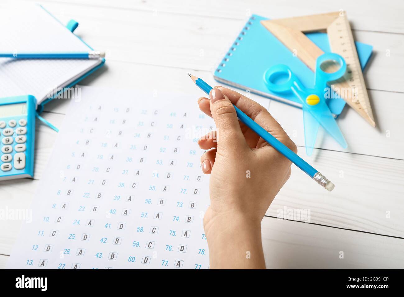Teacher passing pencil student in hi-res stock photography and images ...