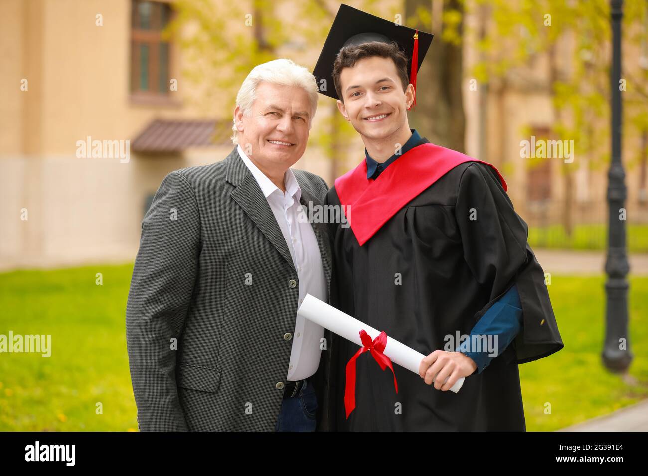 Happy young man with his father on graduation day Stock Photo - Alamy