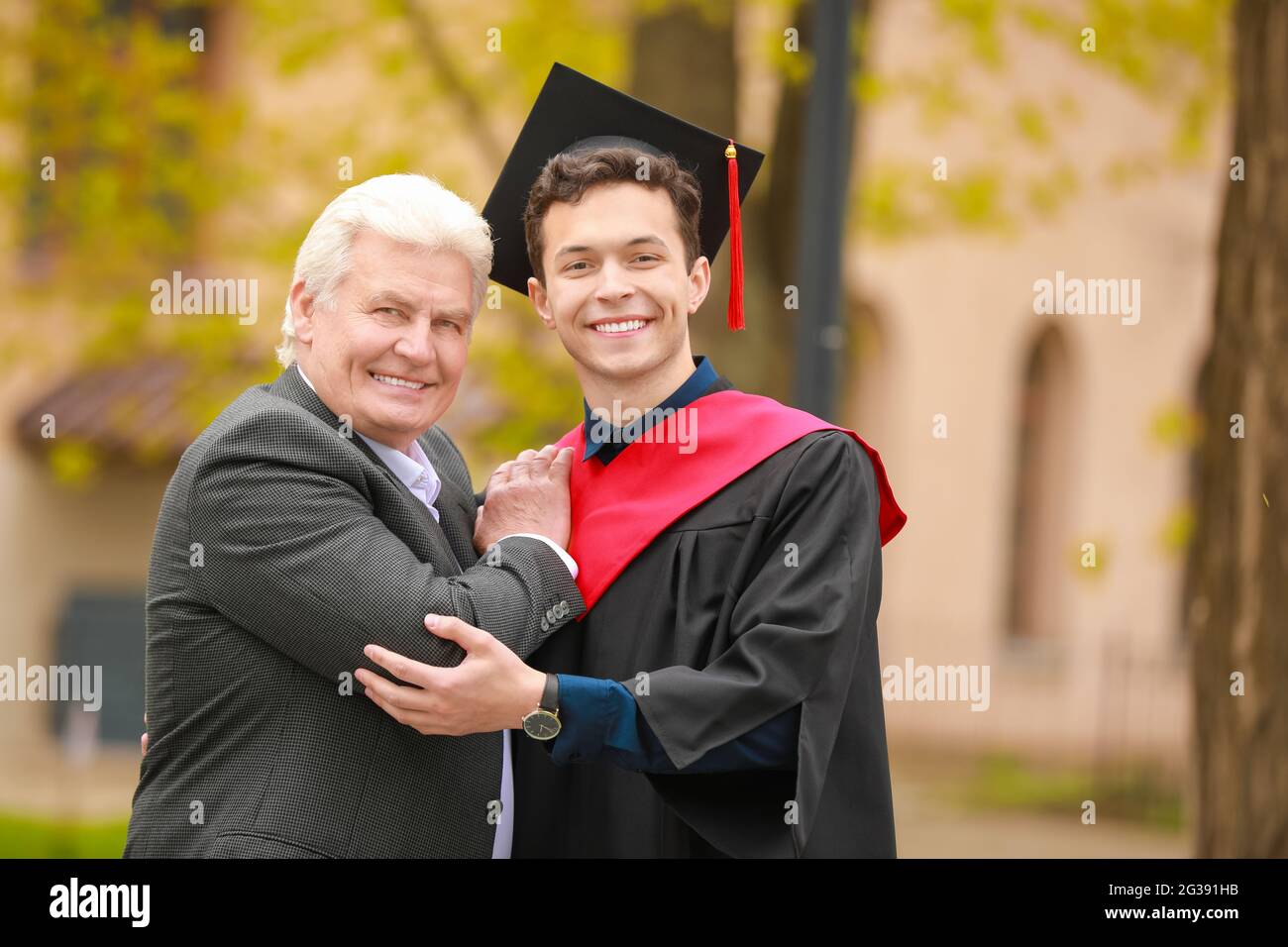 Happy young man with his father on graduation day Stock Photo - Alamy