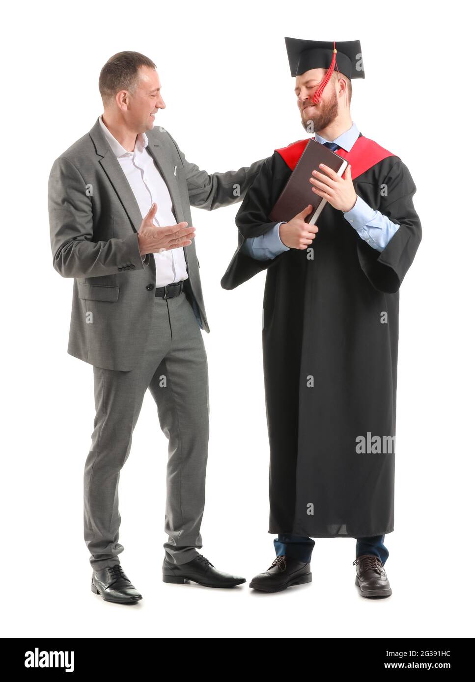 Happy male graduation student with his father on white background Stock ...