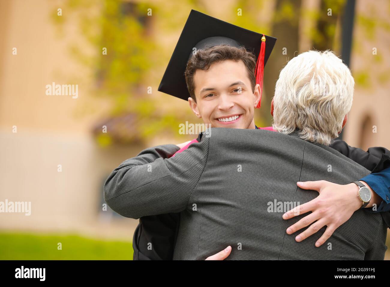 Happy young man with his father on graduation day Stock Photo - Alamy
