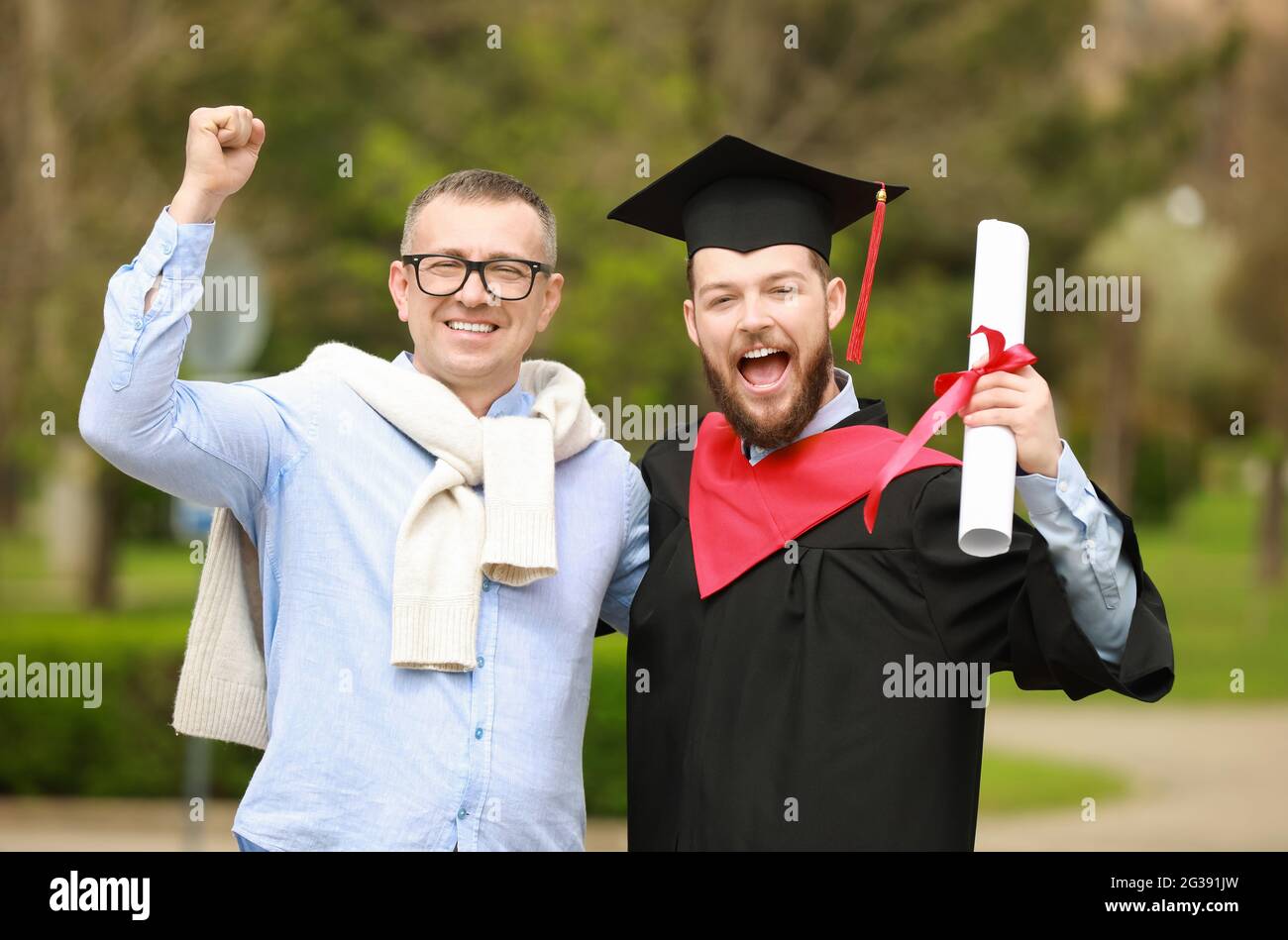 Happy young man with his father on graduation day Stock Photo - Alamy