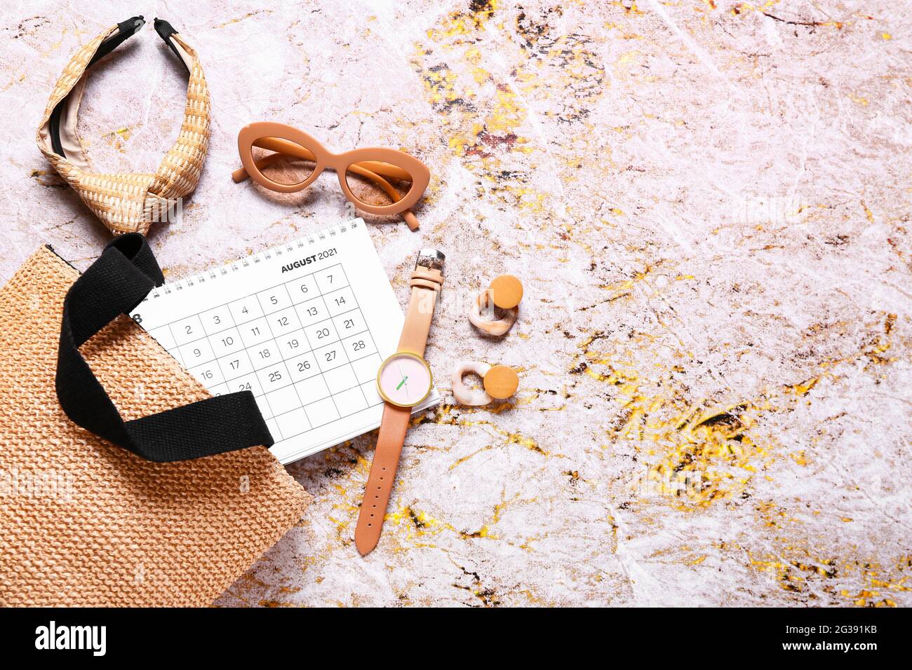 Calendar and female accessories on grunge background Stock Photo - Alamy