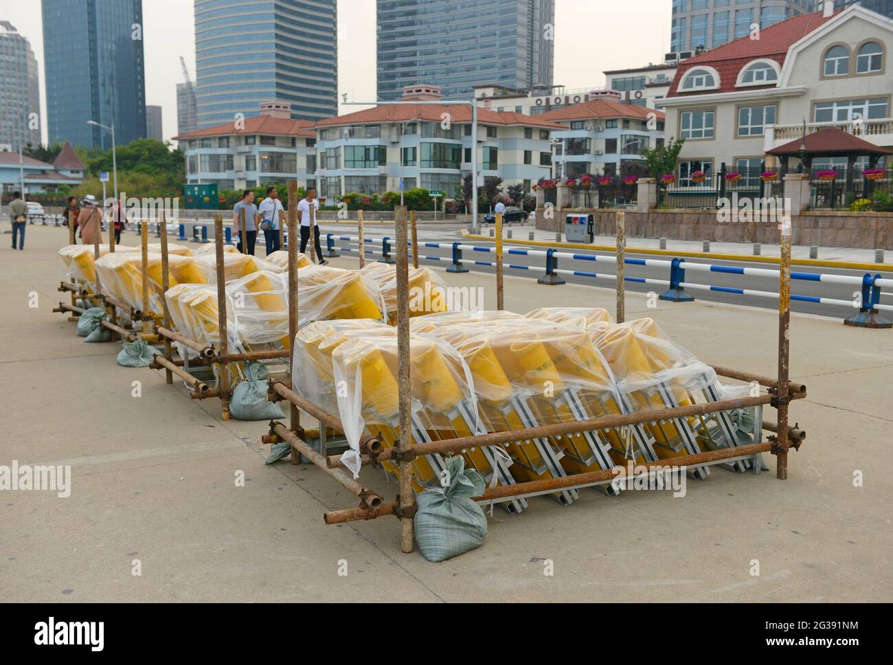 Firework launchers stand ready on the seaside walkway in Qingdao, ahead ...