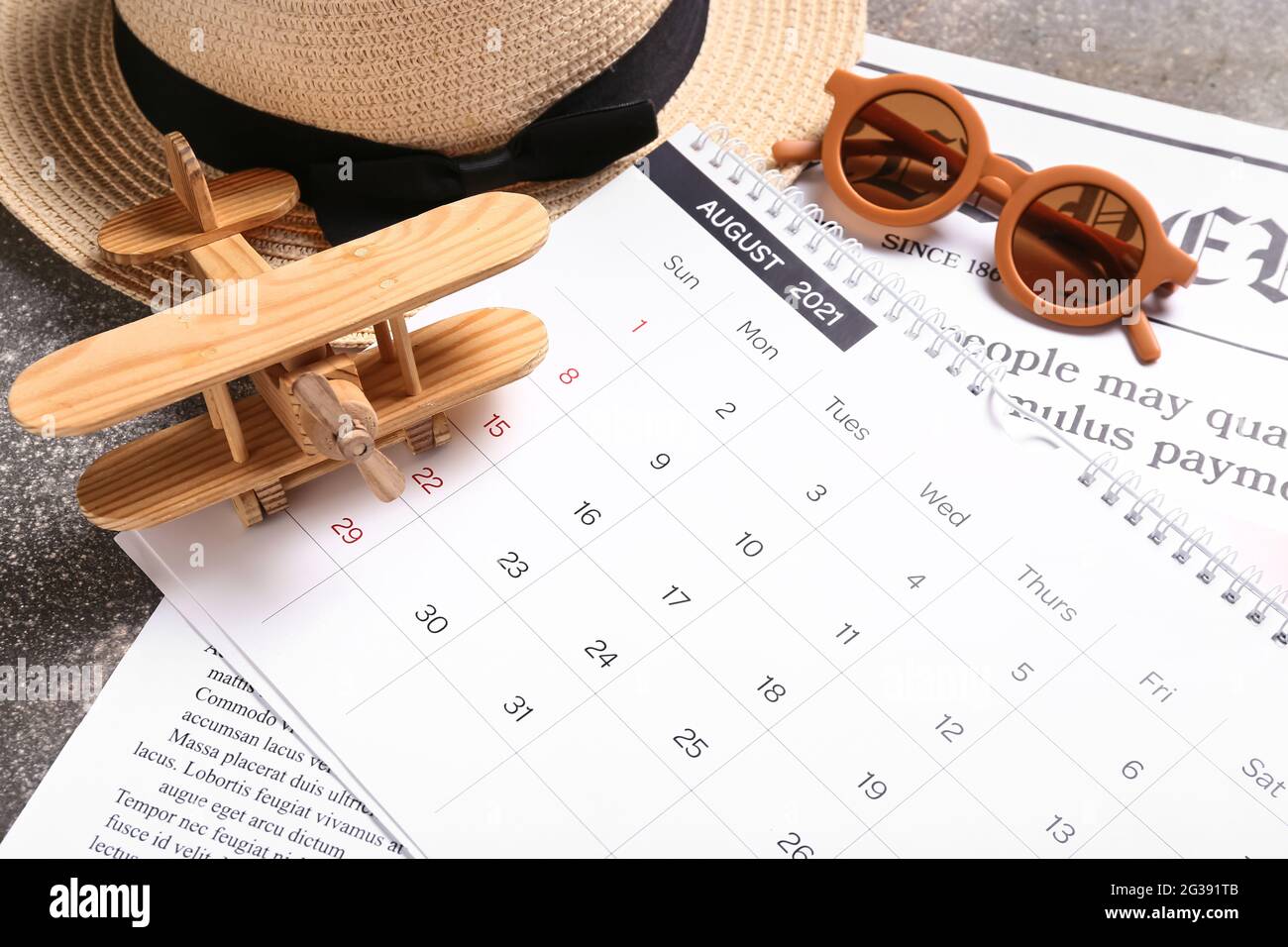 Calendar, newspaper and female accessories on grunge background ...