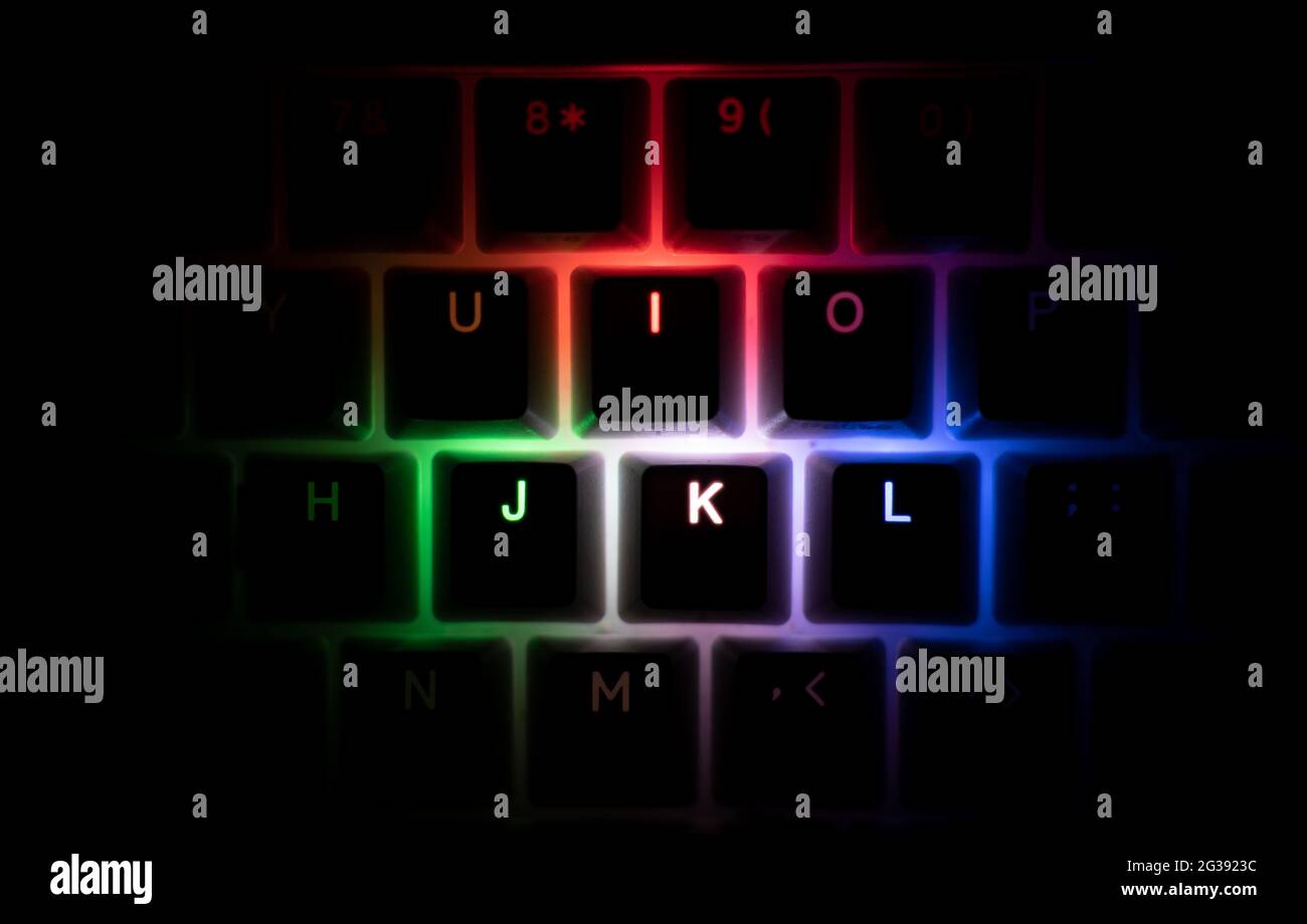 top view detail closeup of illuminated RGB keycaps keys on black on ...