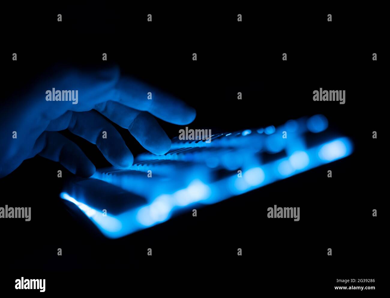 perspective side view detail closeup of male fingers typing on ...