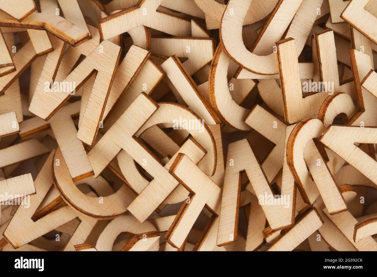 top view closeup detail macro of pile of wooden cut small alphabet ...