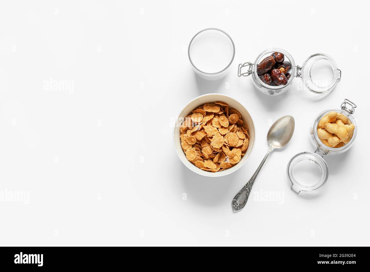 Composition with tasty corn flakes and milk on light background Stock ...