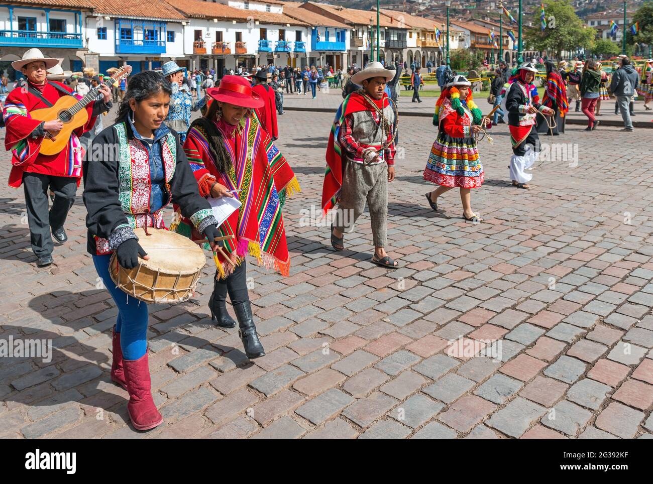 Peruvian people walking in traditional clothing during Inti Raymi sun ...