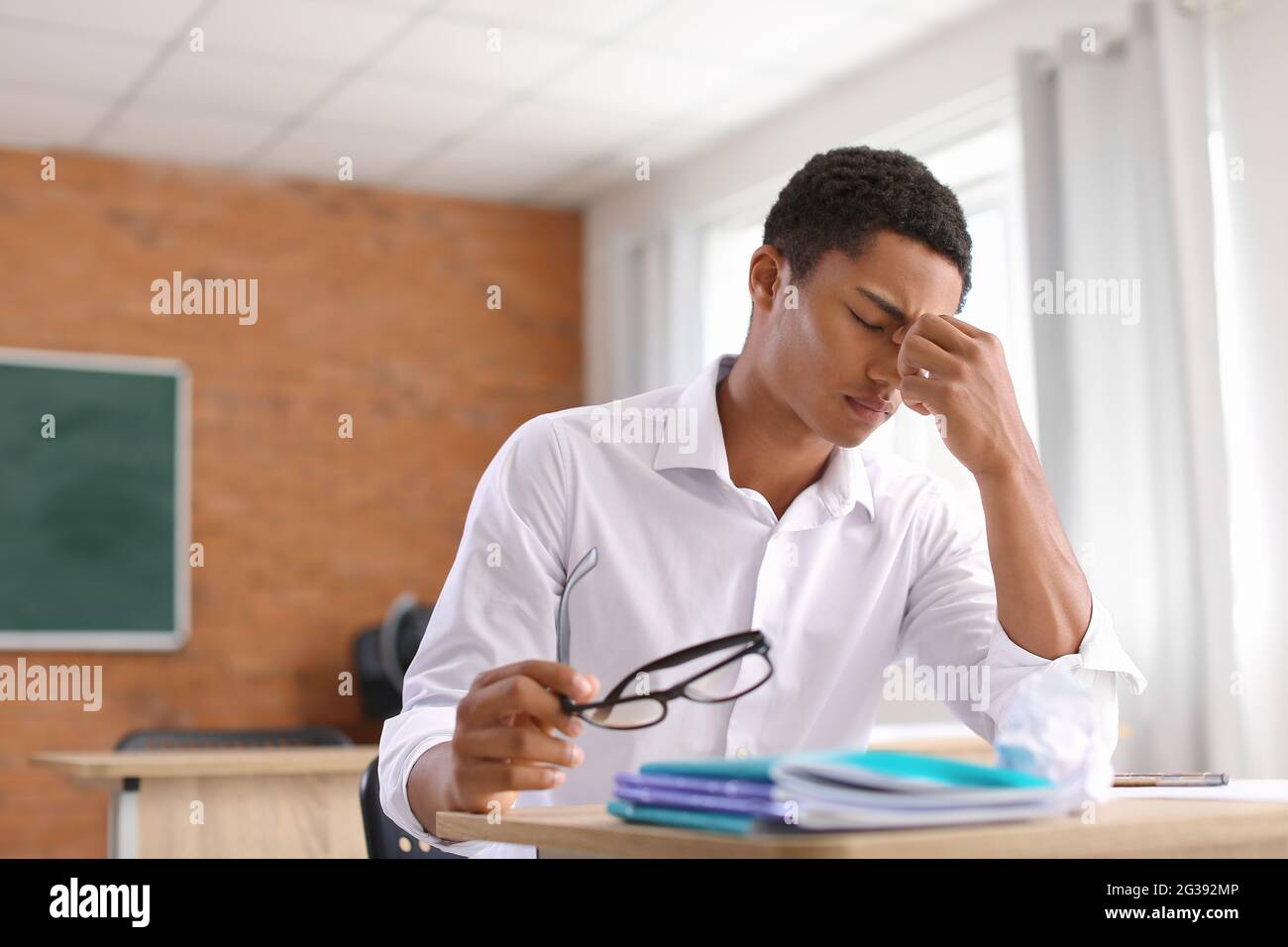 African-American student passing difficult exam at school Stock Photo ...
