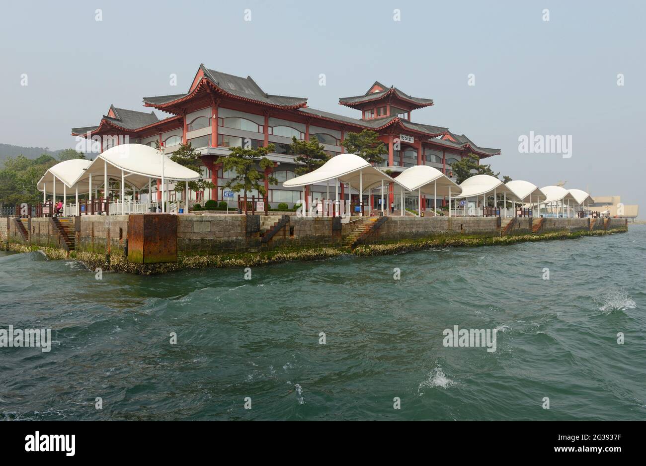 Harbour jetty area and arrival/departure lounges on Liugong Island ...