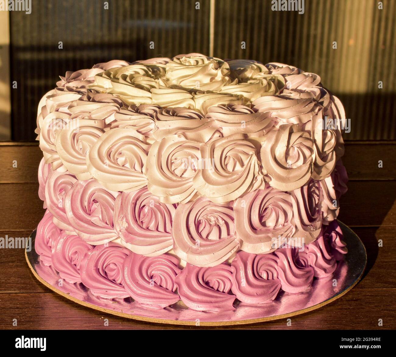 wonderful pink cake with rose design Stock Photo - Alamy