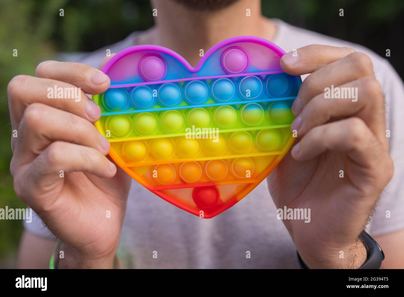 man using pop it fidget toy closeup Stock Photo - Alamy