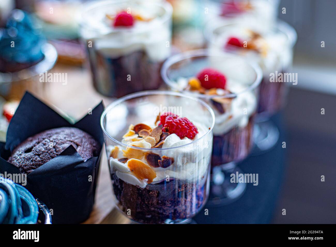 Table with loads of cakes, cupcakes and desserts with fruits Stock ...