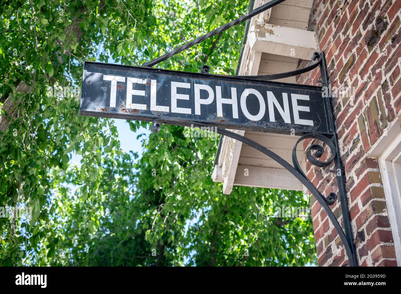 Telephpone sign on historic brick building in Lethbridge Stock Photo ...