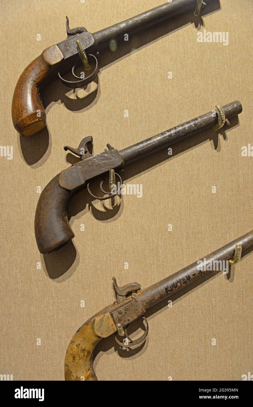 Three nineteenth century pistols on display in a museum in Yantai ...