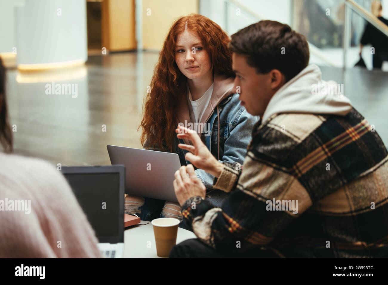 Students in group study at university campus. Young man at high school ...