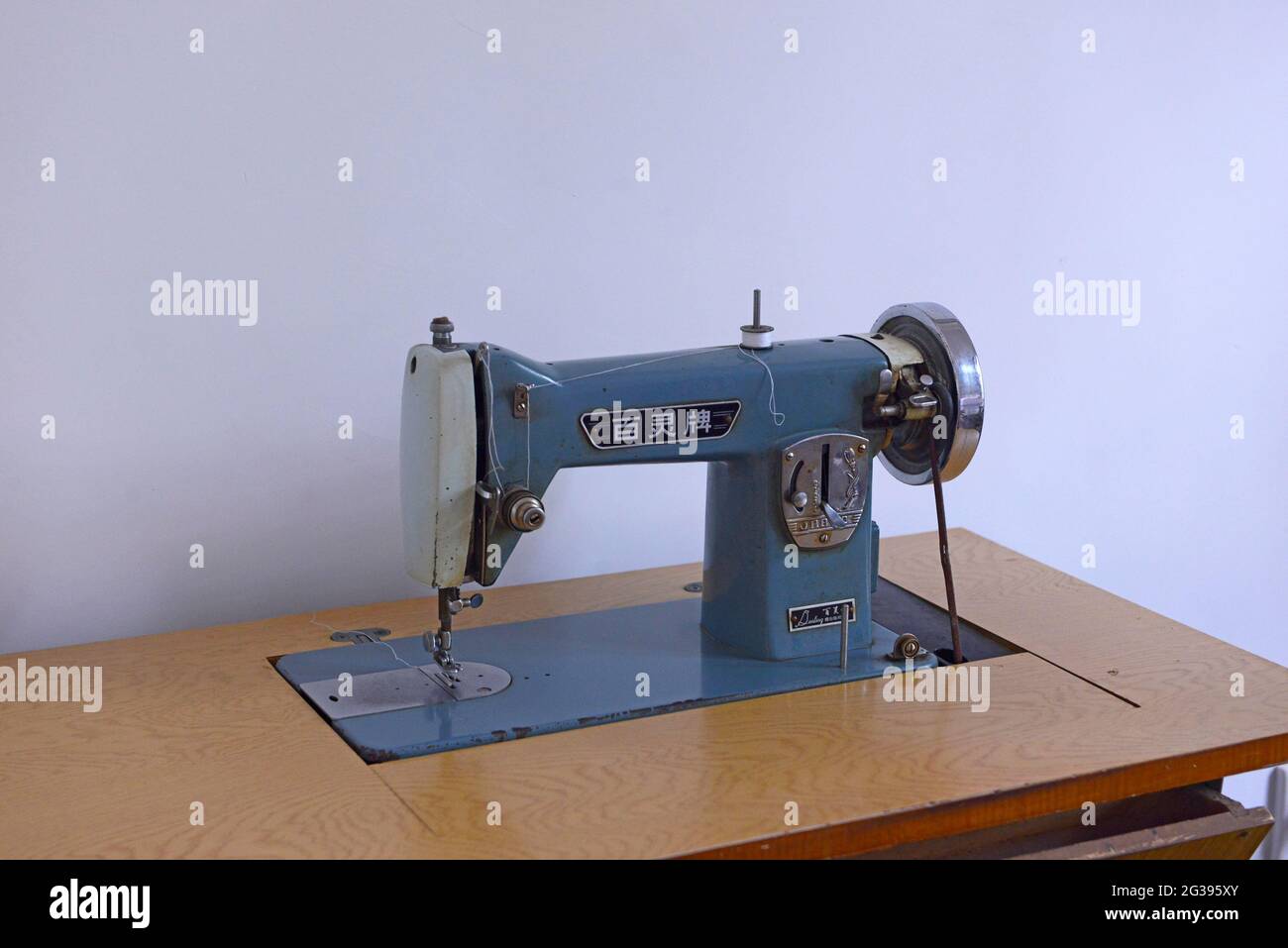 A vintage Bailing brand sewing machine on display at the Qipao museum ...