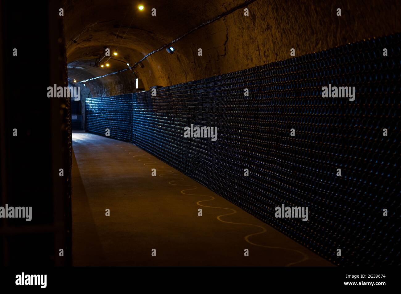 Champagne grand cru sparkling wine production in bottles in rows in ...