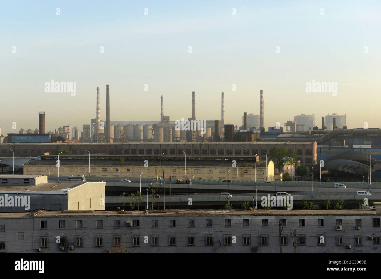 Industrial buildings and an elevated highway in Shandong province, near the provincial capital ...