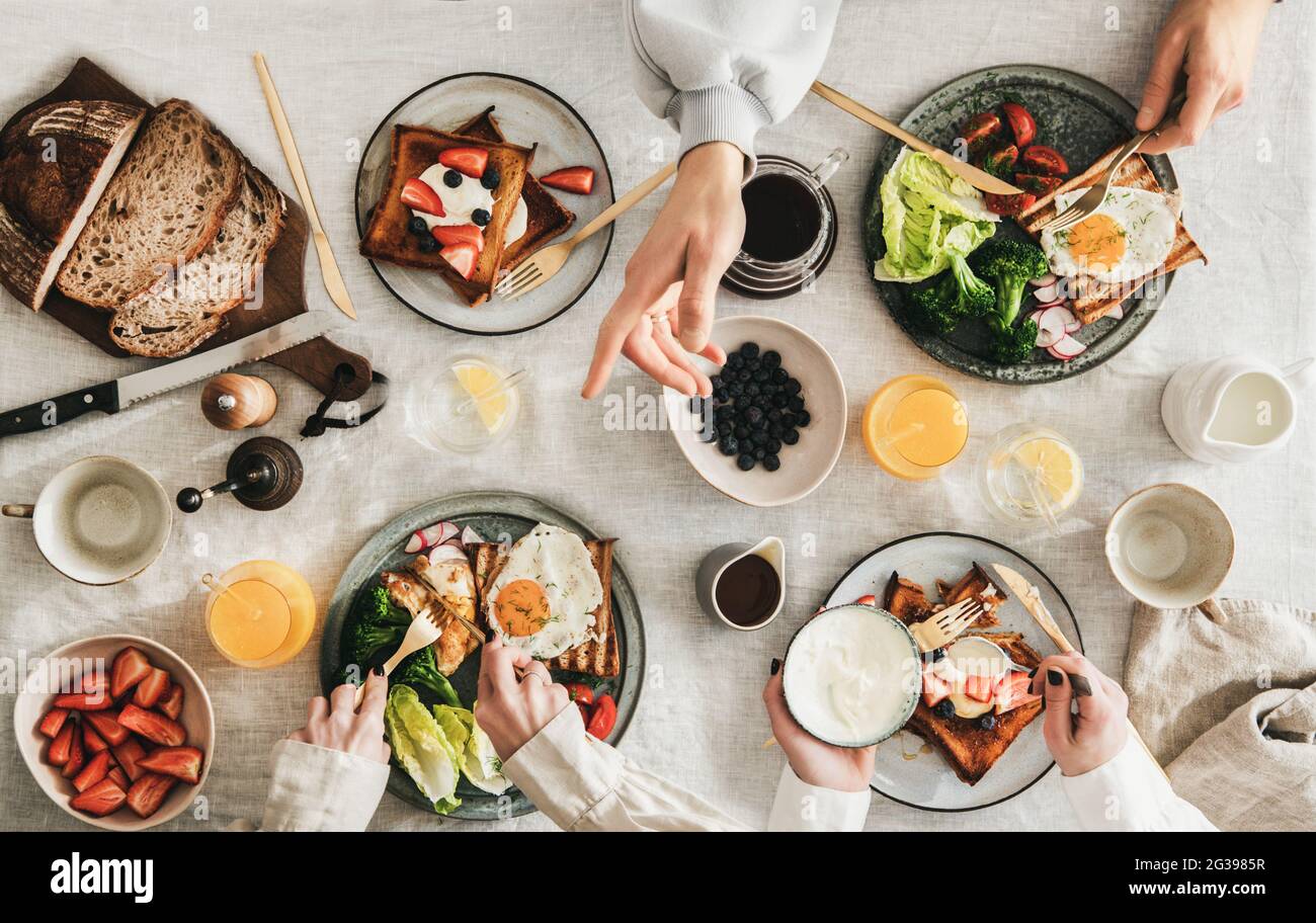 Group of people Friends having breakfast or gathering brunch Stock ...