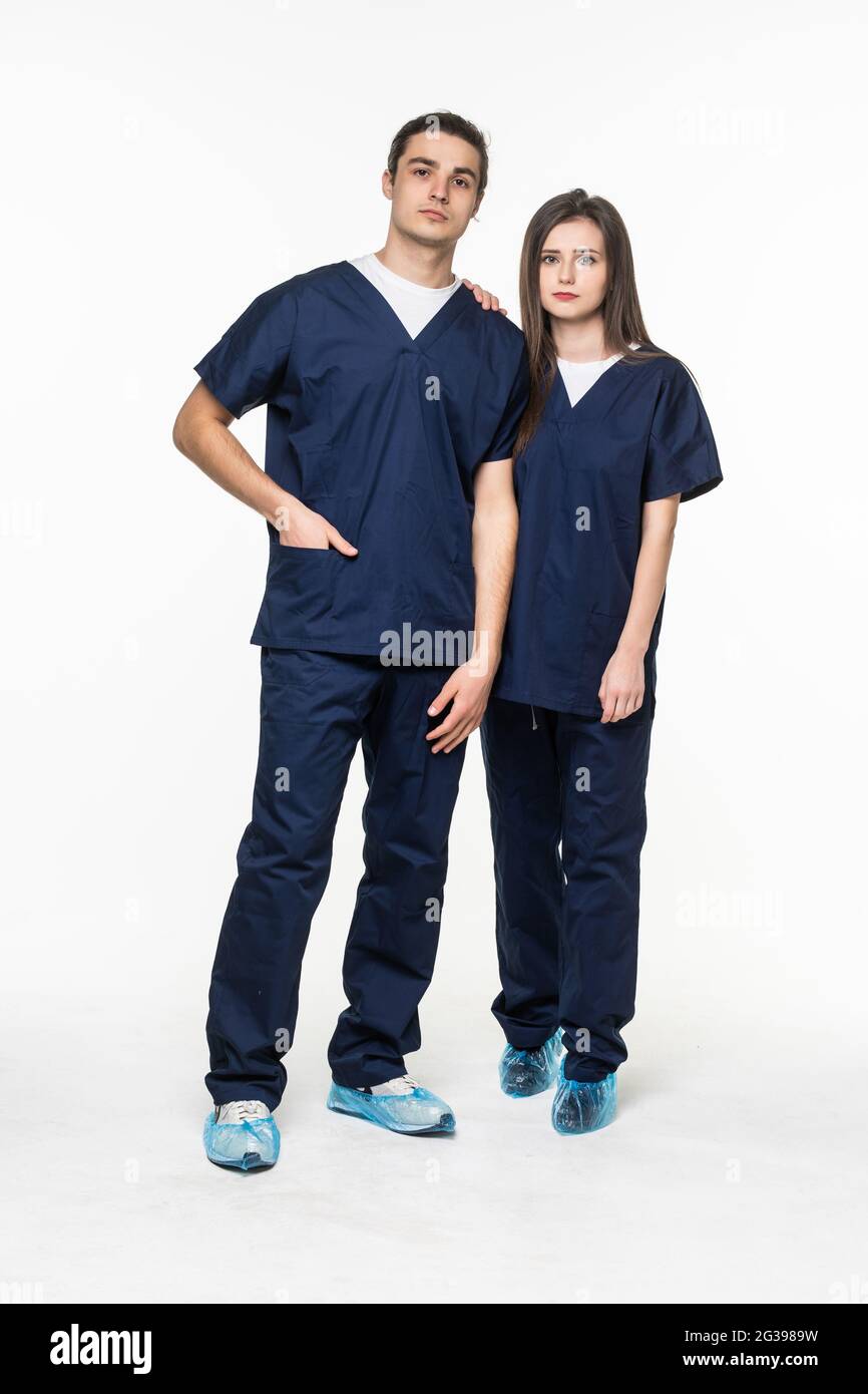 Two beautiful young doctors isolated over white background Stock Photo ...
