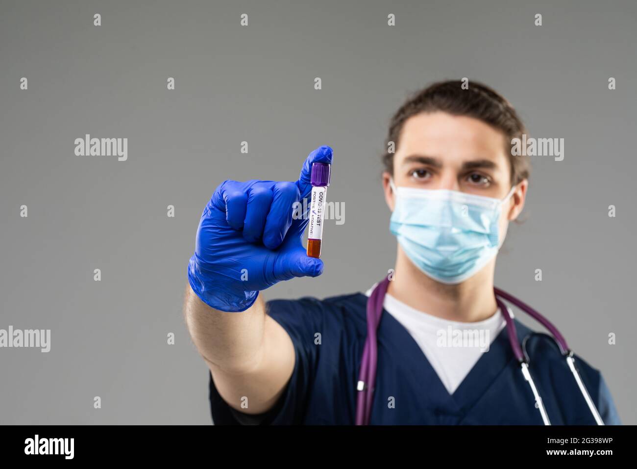 a young scientist investigates a blood test for coronavirus ...