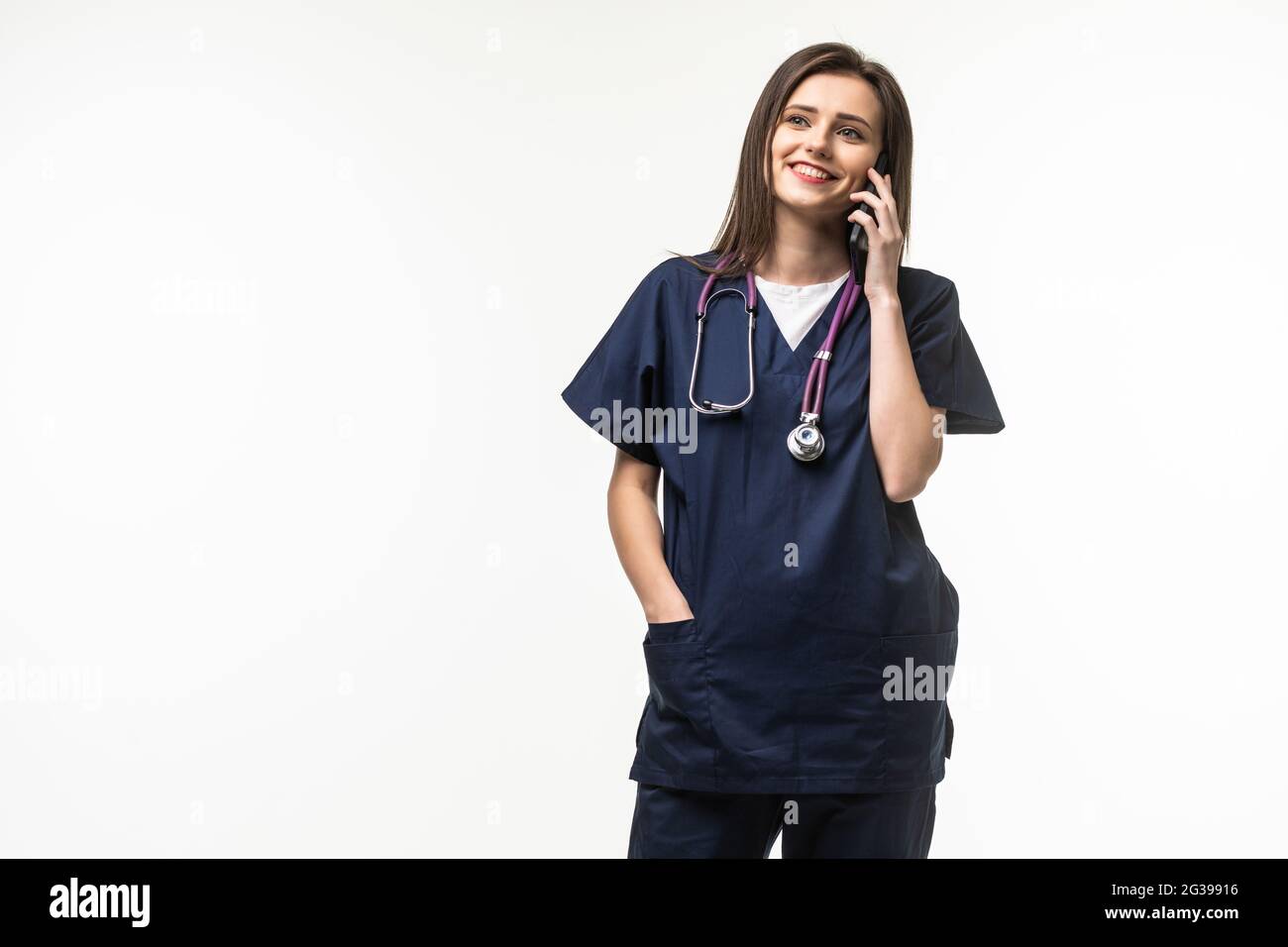 Young doctor woman keeping a conversation with the mobile phone on ...